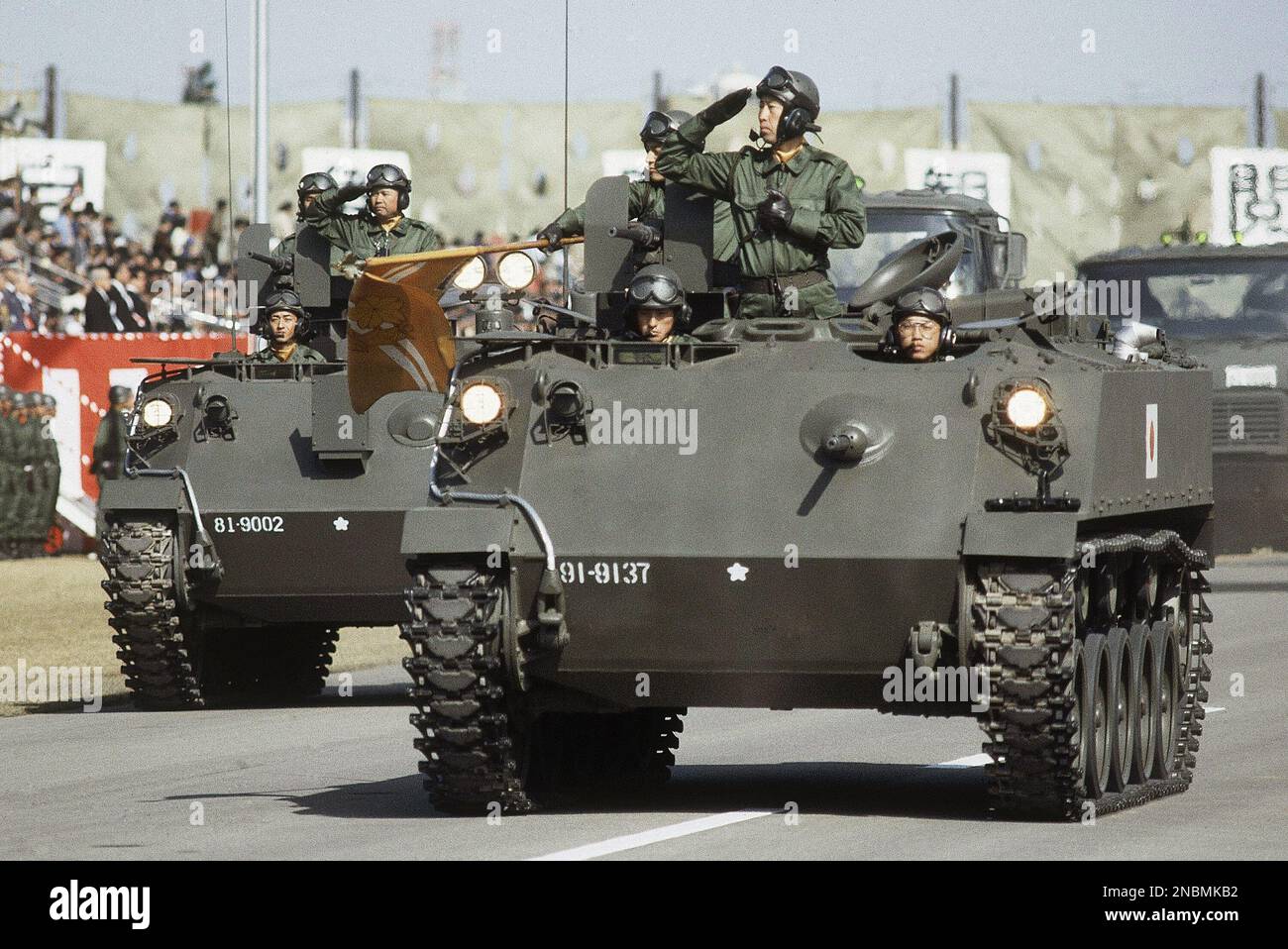 Japan’s ground self-defense forces military parade goes past a ...