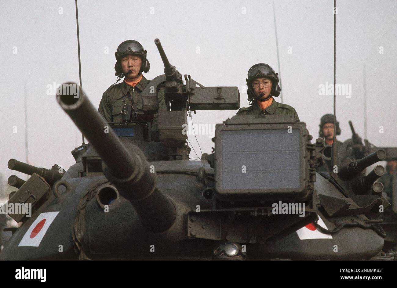 Japan’s ground self-defense forces military parade goes past a ...