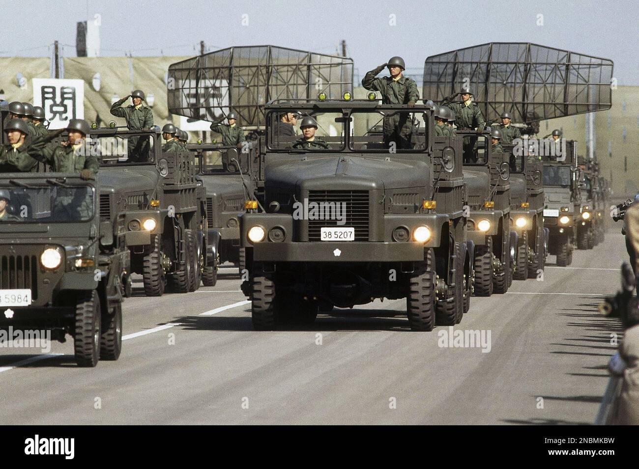 Japan’s ground self-defense forces military parade goes past a ...