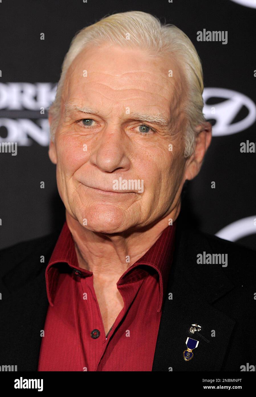 Dale Dye, a cast member in "Falling Skies," poses at the premiere ...