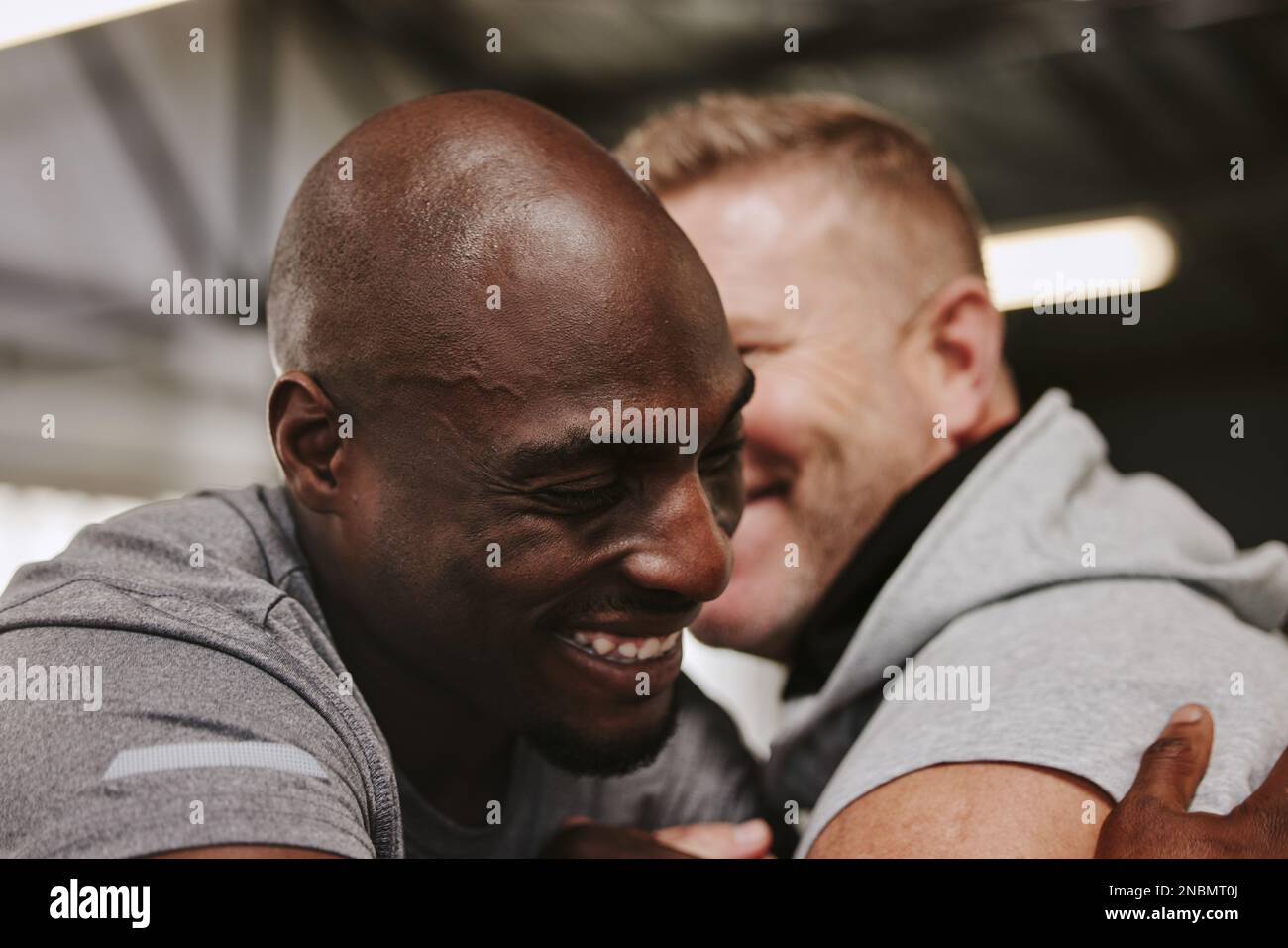 Gym, hug and personal trainer with man for fitness, goal and motivation ...