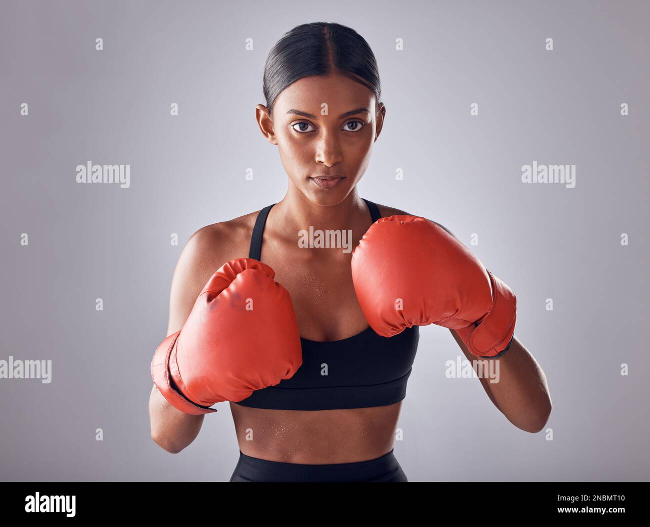 Boxing, fitness and portrait of woman in studio for sports exercise ...