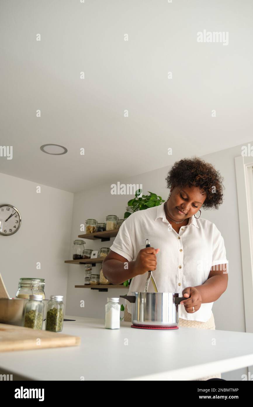 Woman mashing potatoes hi-res stock photography and images - Alamy