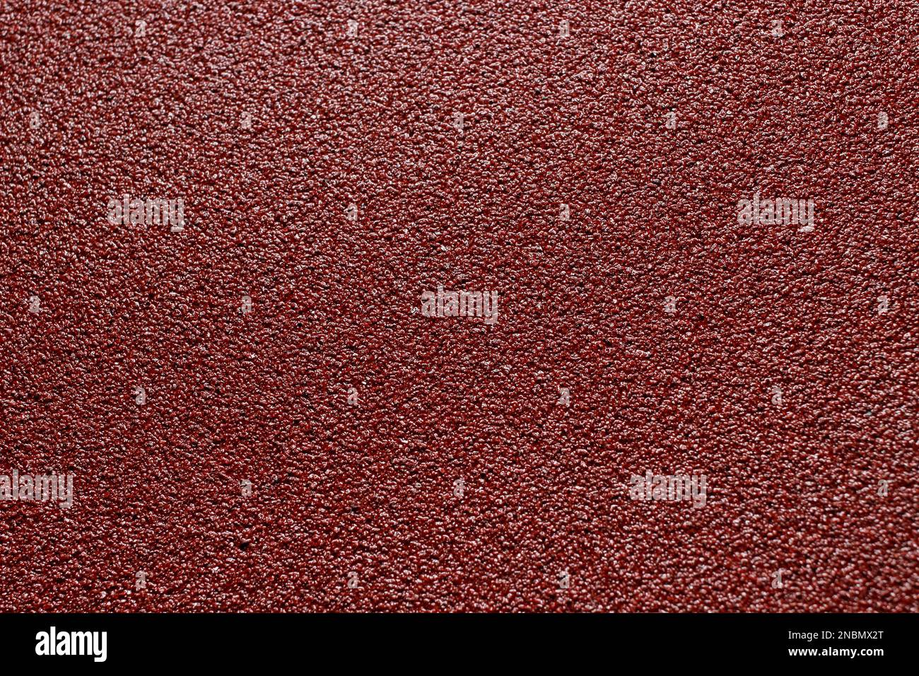 sandpaper red color close up background texture Stock Photo - Alamy