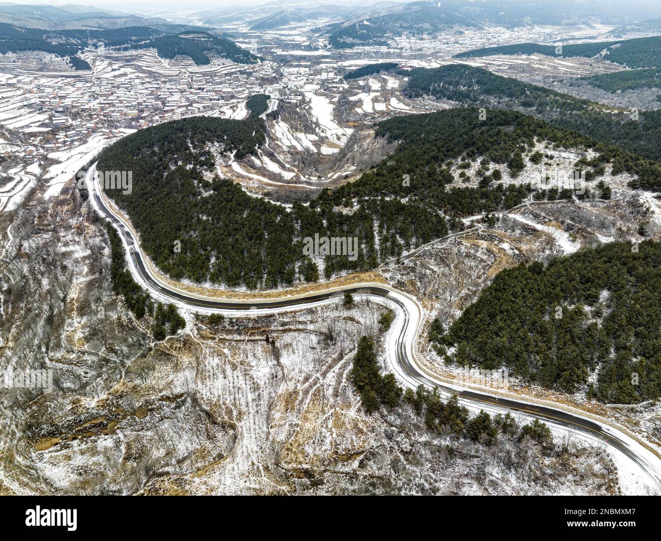 Aerial photo shows snow-covered village around the Taihang Mountains in ...