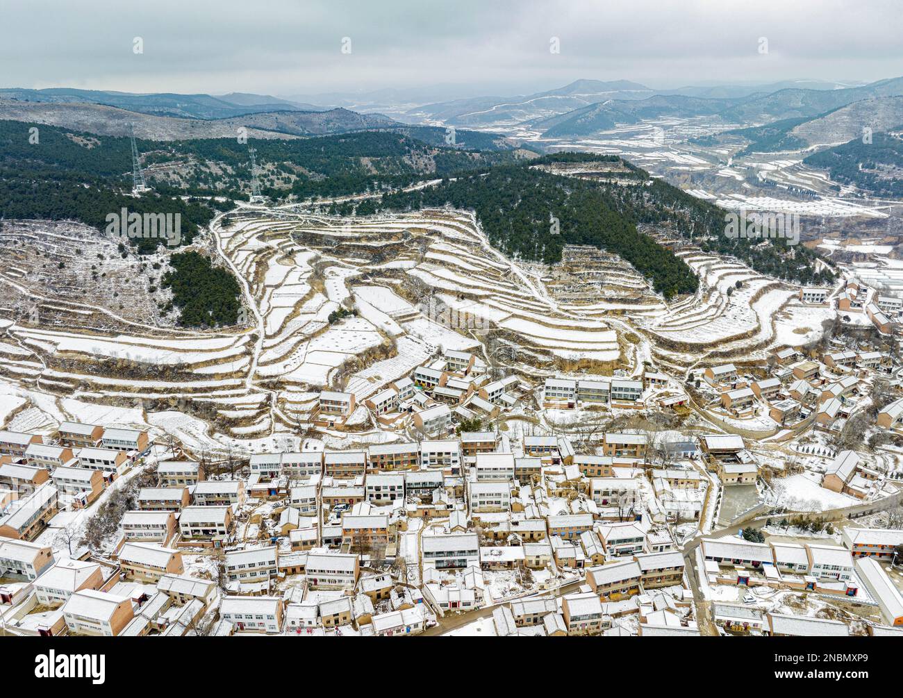 Aerial photo shows snow-covered village around the Taihang Mountains in ...