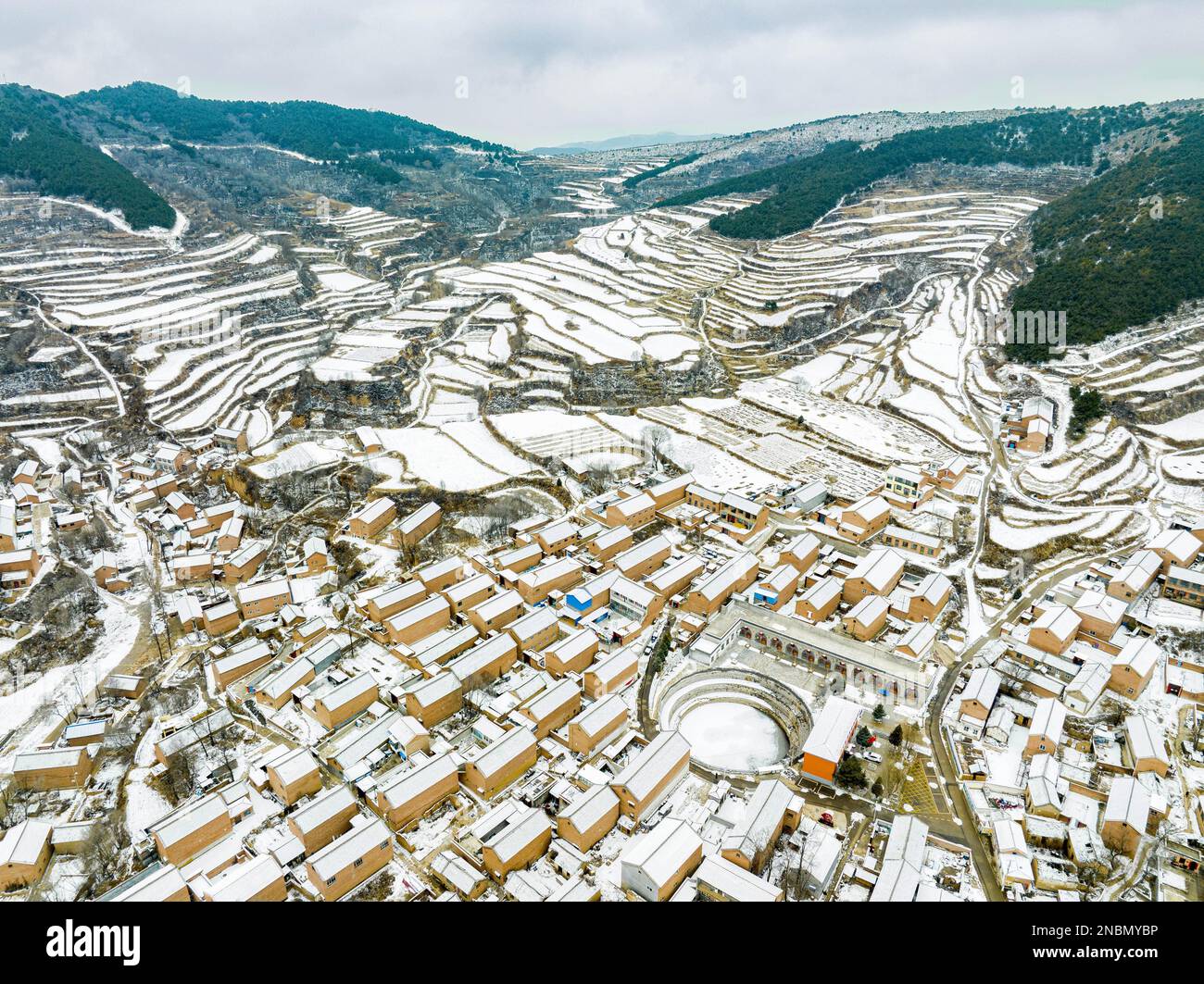 Aerial photo shows snow-covered village around the Taihang Mountains in ...