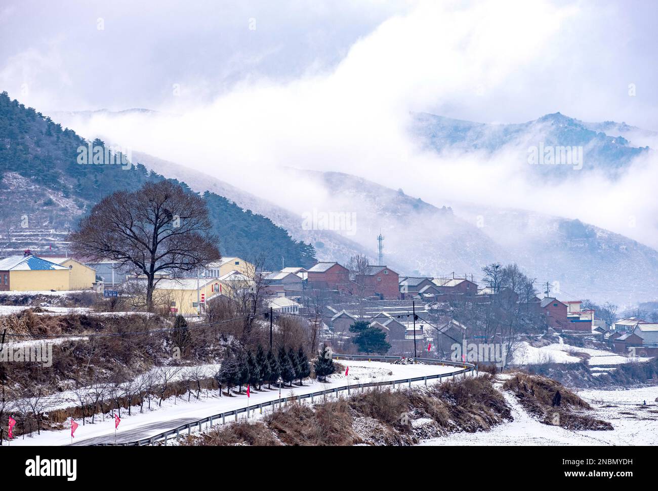 Aerial photo shows snow-covered village around the Taihang Mountains in ...