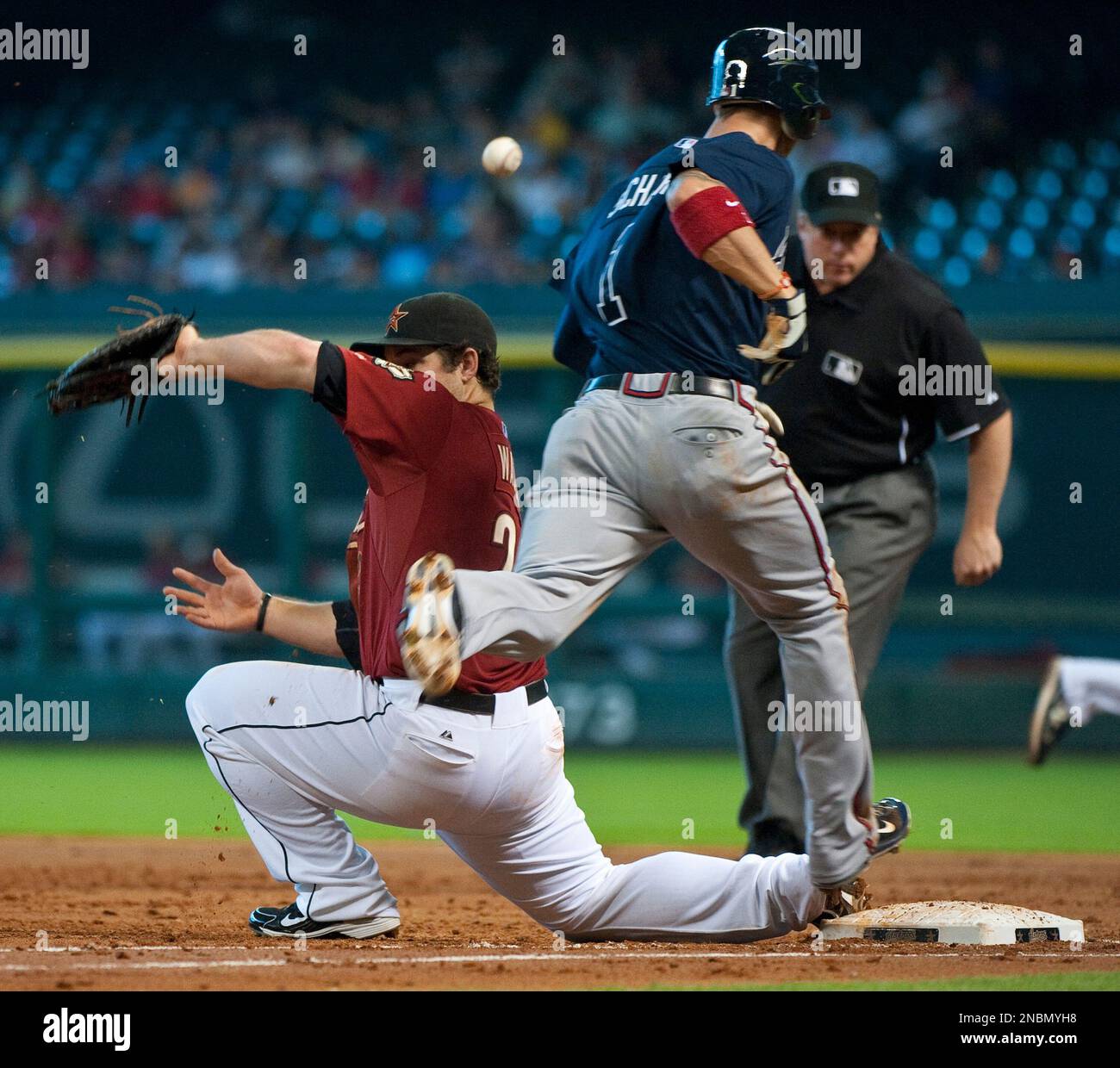Atlanta Braves' Jordan Schafer, front right, is safe after a bunt as ...