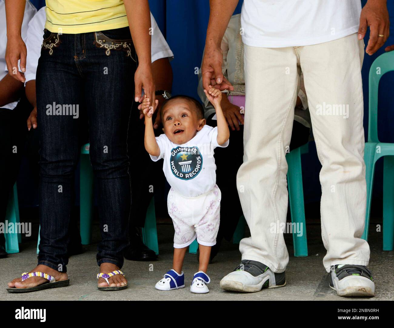 Junrey Balawing is held by his parents as he is introduced during the ...