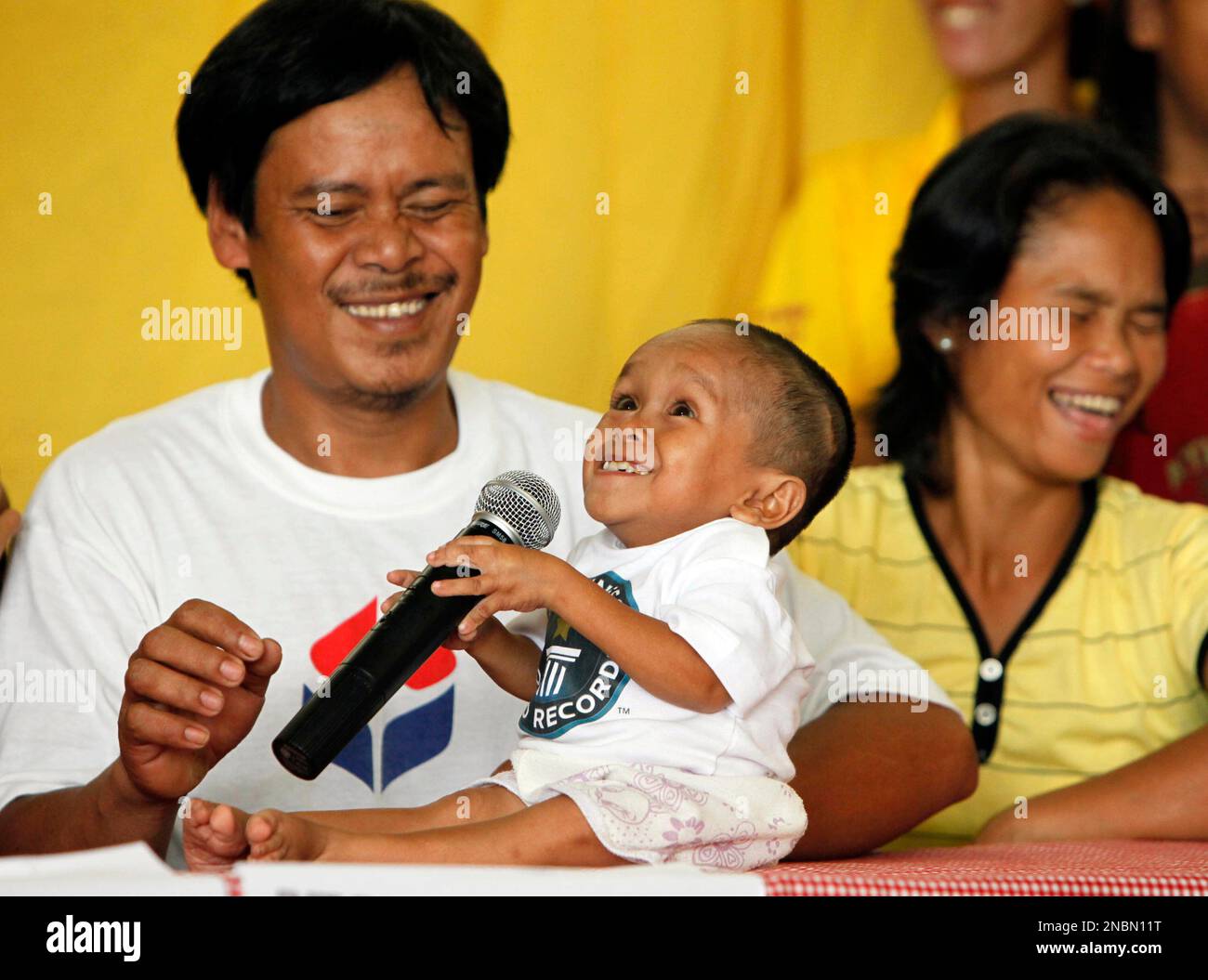 Reynaldo, left, and Concepcion Balawing, parents of Junrey Balawing, center, 18, react as Junrey ...