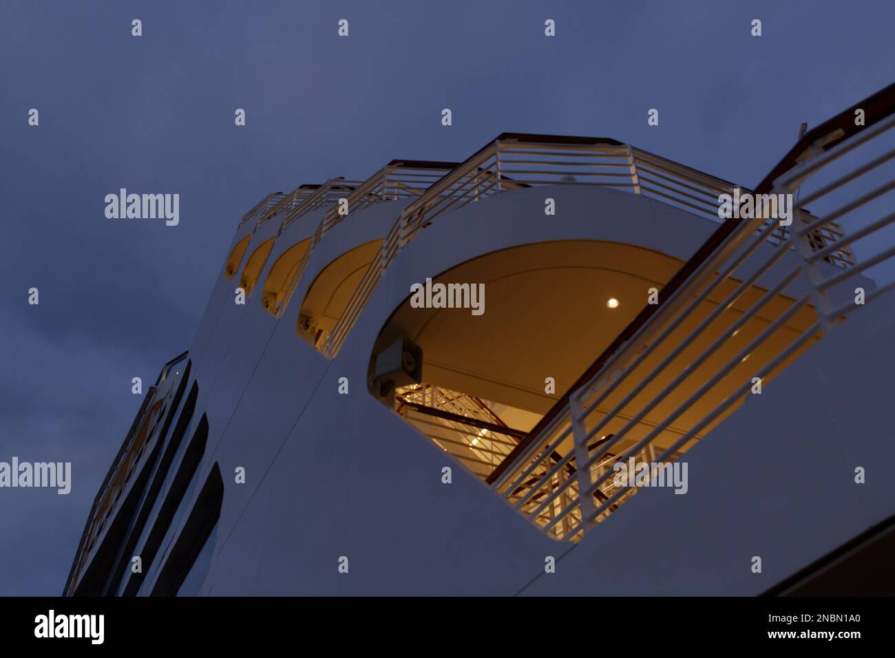 Cruise ship. A vertical angled view of the rear/aft balcony section of ...