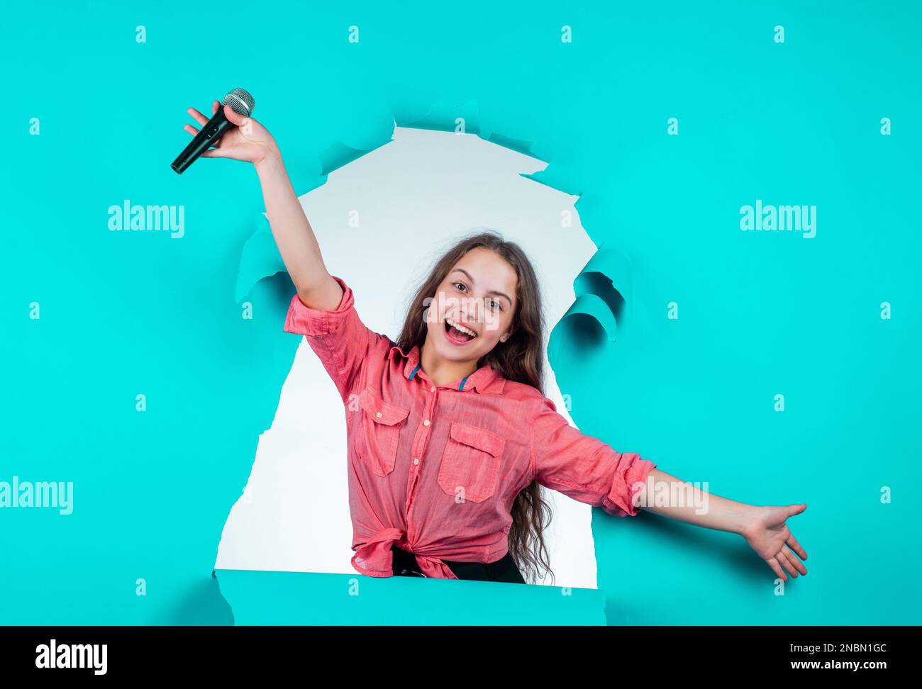 happy singer with microphone. girl singing. vocal school concept ...