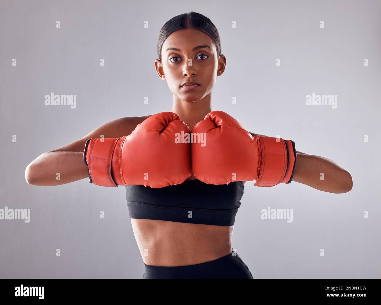 Boxing, hand gloves and portrait of woman in studio for sports exercise ...