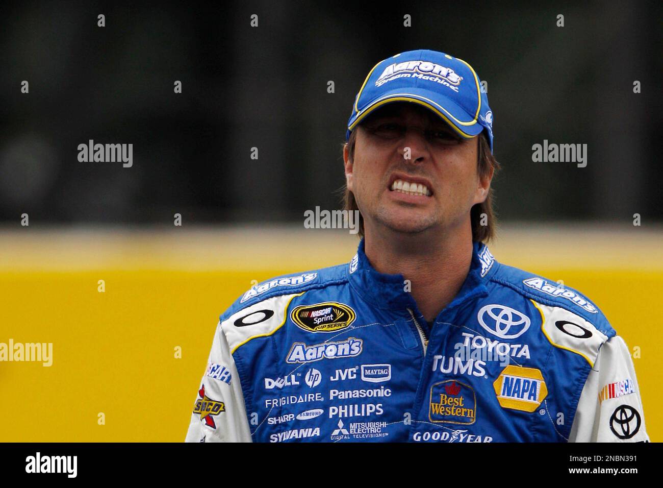 David Reutimann grimaces as he watches a replay of Mike Skinner ...