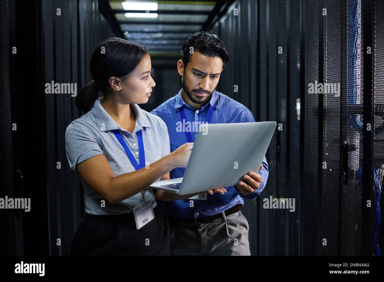 Laptop, server room and technician people problem solving in database ...