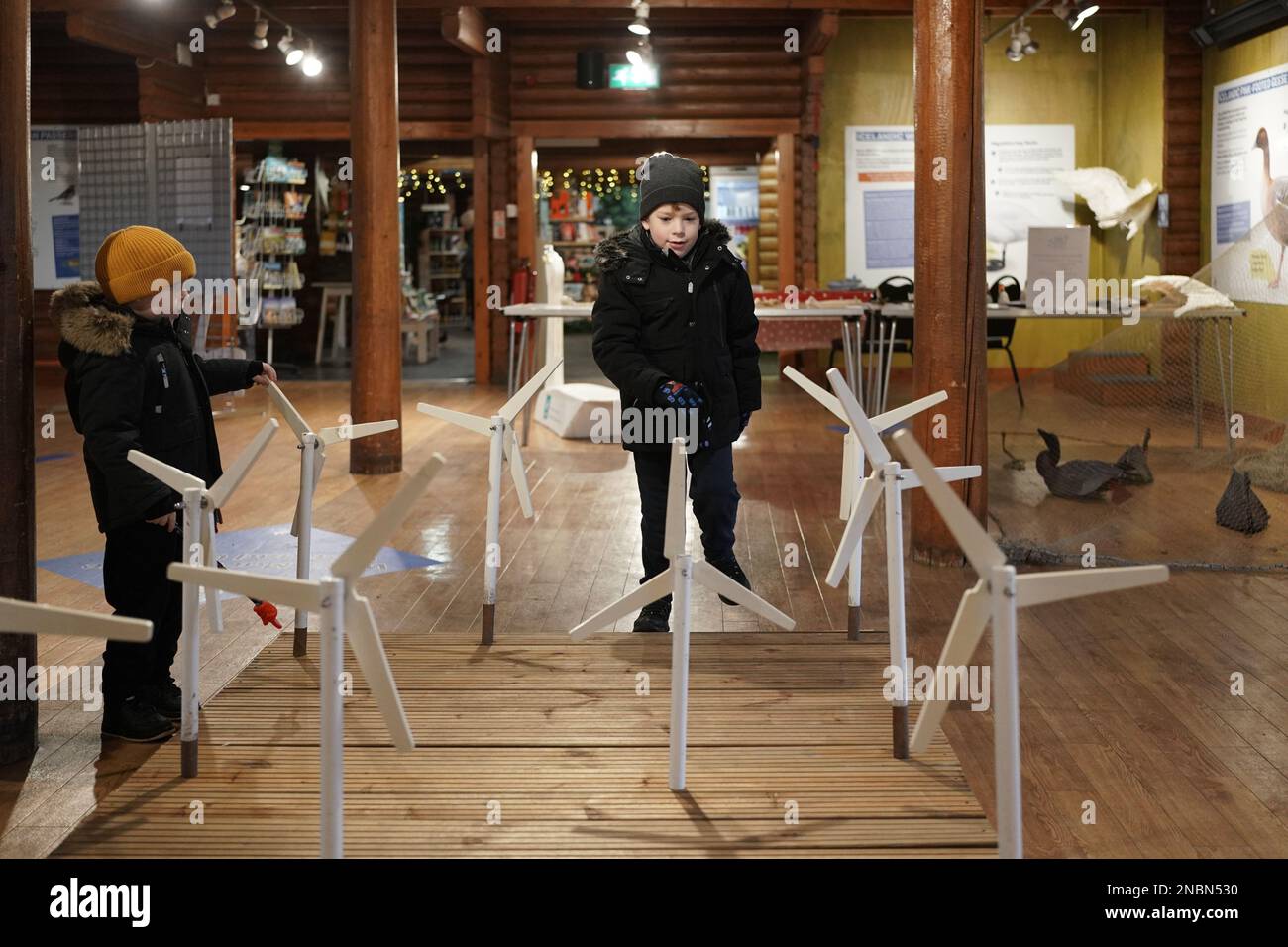 Two children explore at model wind farm at Martin Mere Centre Stock ...