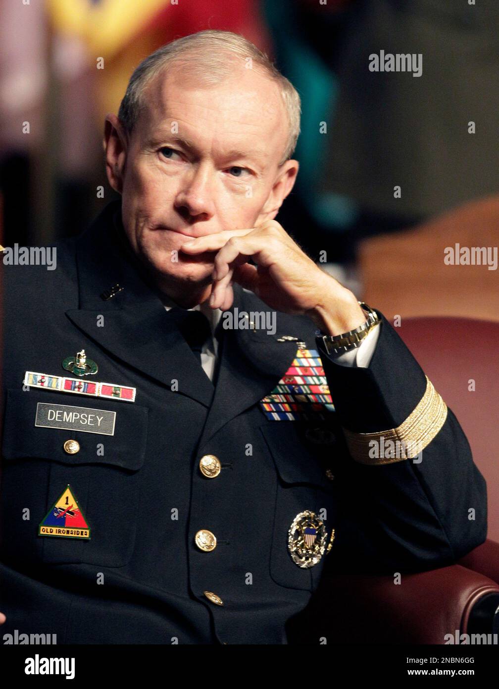 Gen. Martin Dempsey listens to introductions during a graduation ...