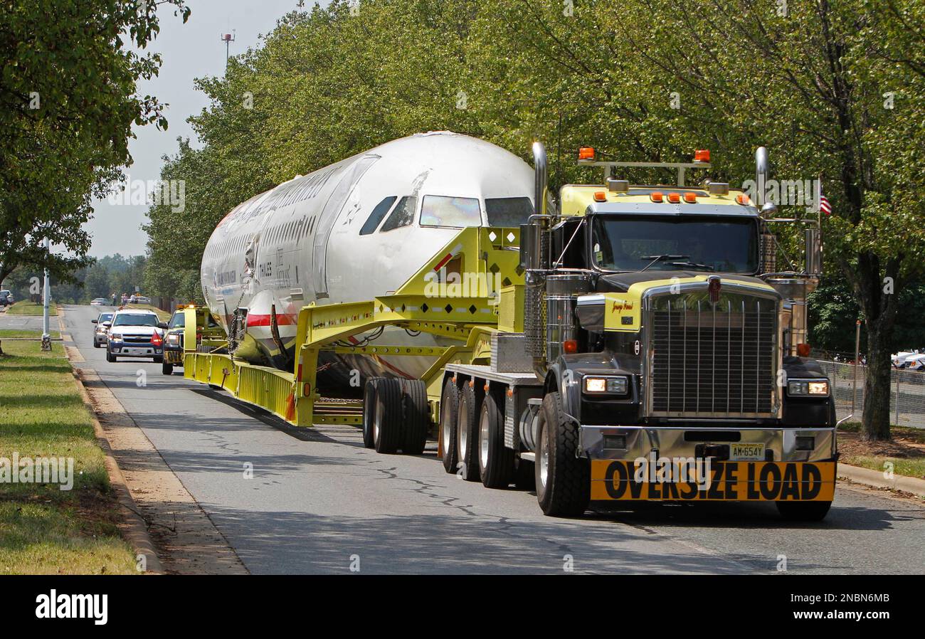 A flatbed truck carries the fuselage of US Airways flight 1549 as it ...