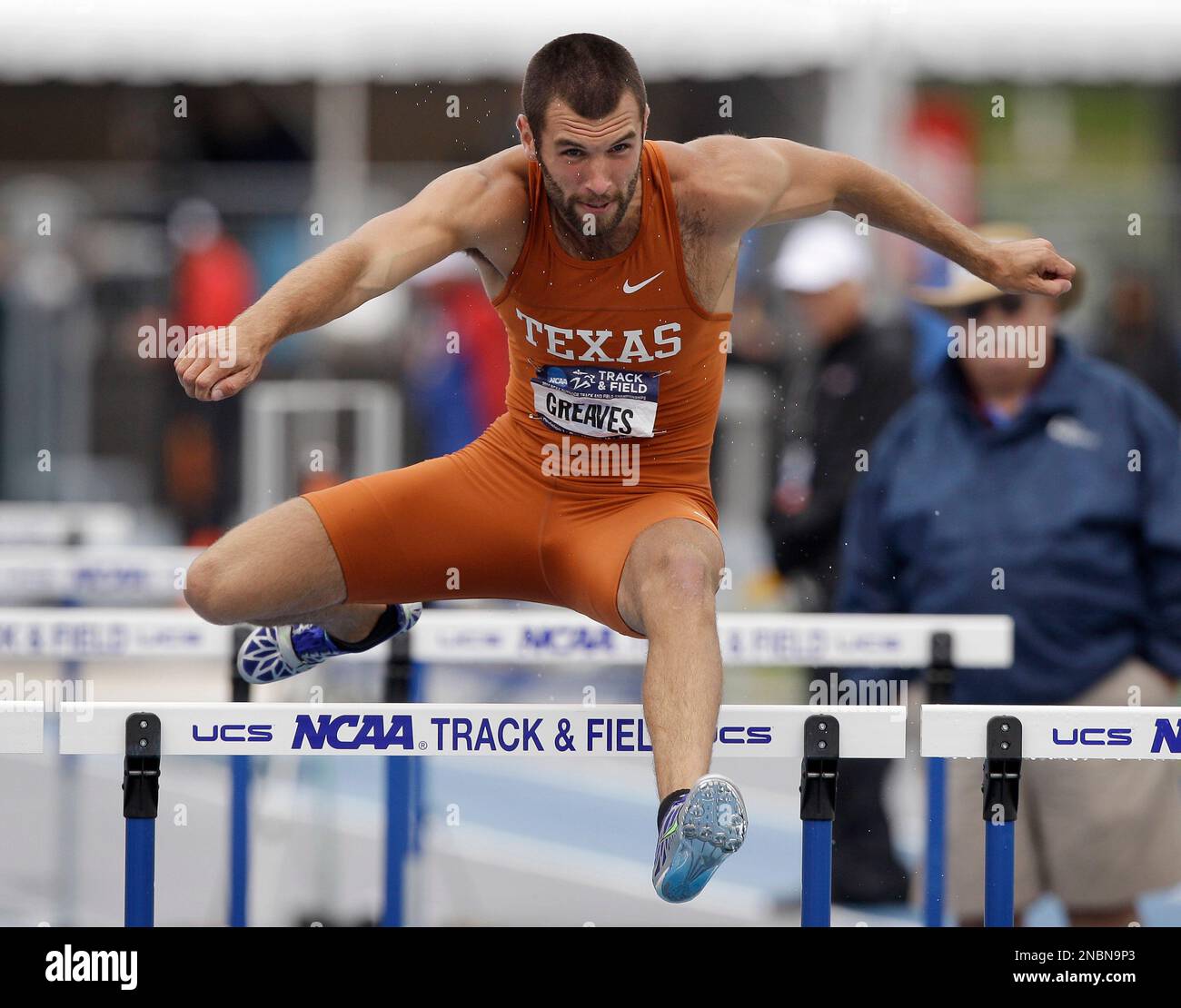 Texas' Kenny Greaves clears a hurdle during his heat in the decathlon ...