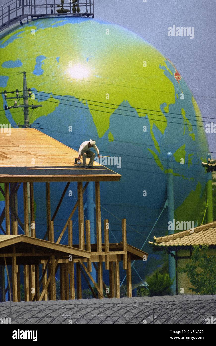 A giant world map is painted on the surface of a gas storage tank that ...