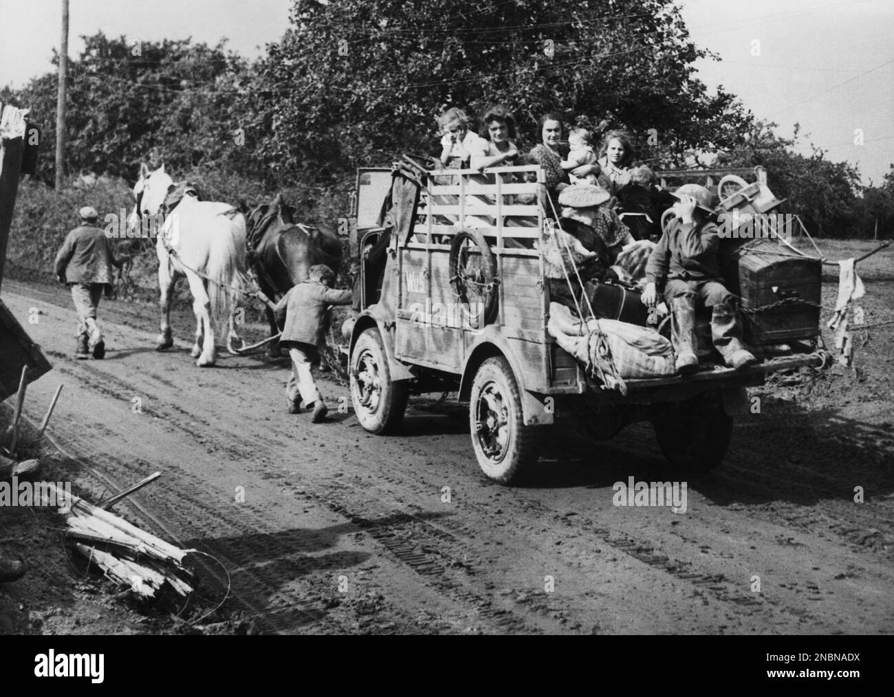 French refugees returning to their home behind allied front line on an ...