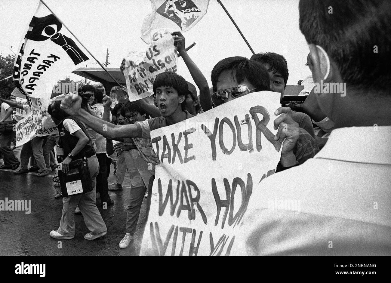 Demonstrators at Malacanang Palace in Manila on April 7, 1986, yell ...