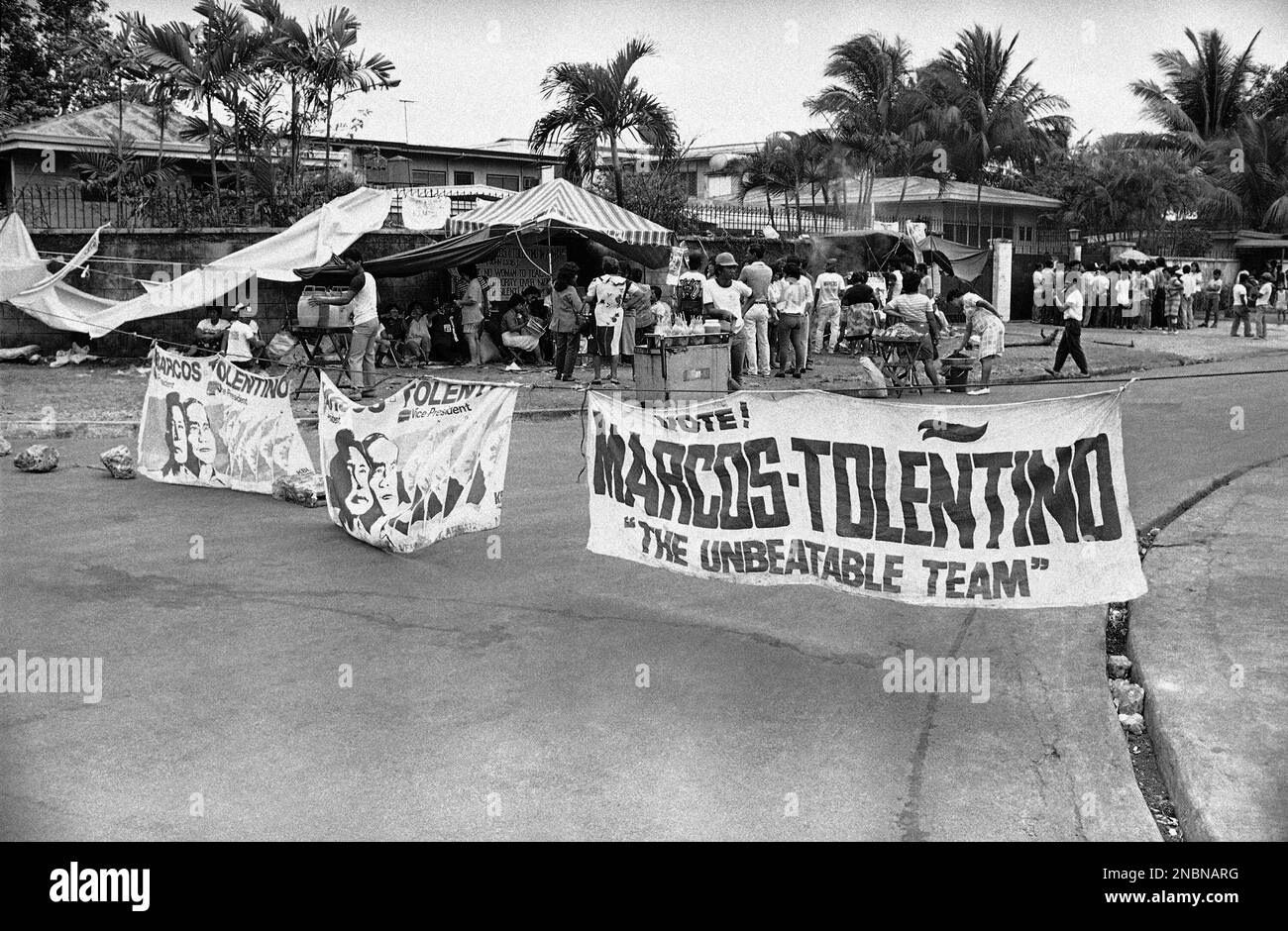About 100 supporters of ousted President Ferdinand E. Marcos camp ...