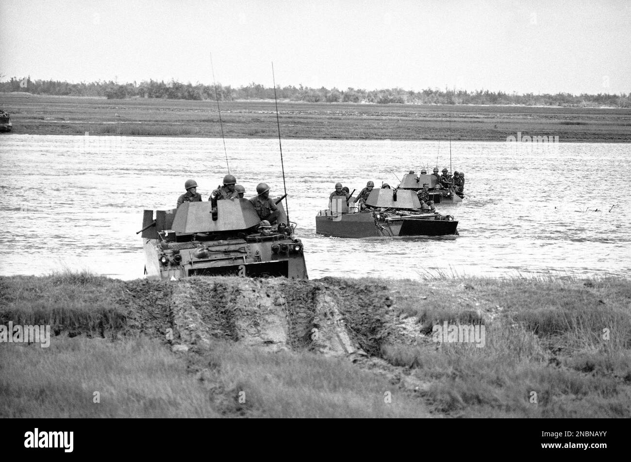 Armed personnel carriers carry South Vietnamese troops across a river ...