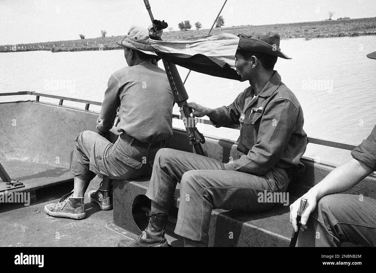 A South Vietnamese soldier holds a rifle with a blue-brown scarf ...
