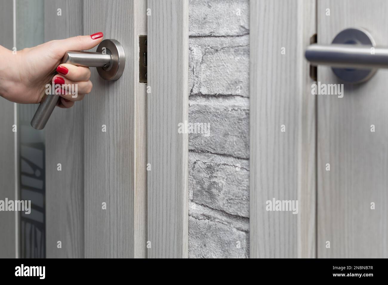 Man woman opens the door hi-res stock photography and images - Alamy