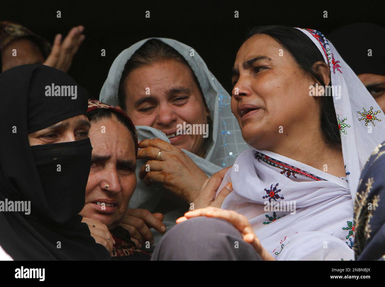 Family members of the allegedly executed boy mourn his death in Karachi ...