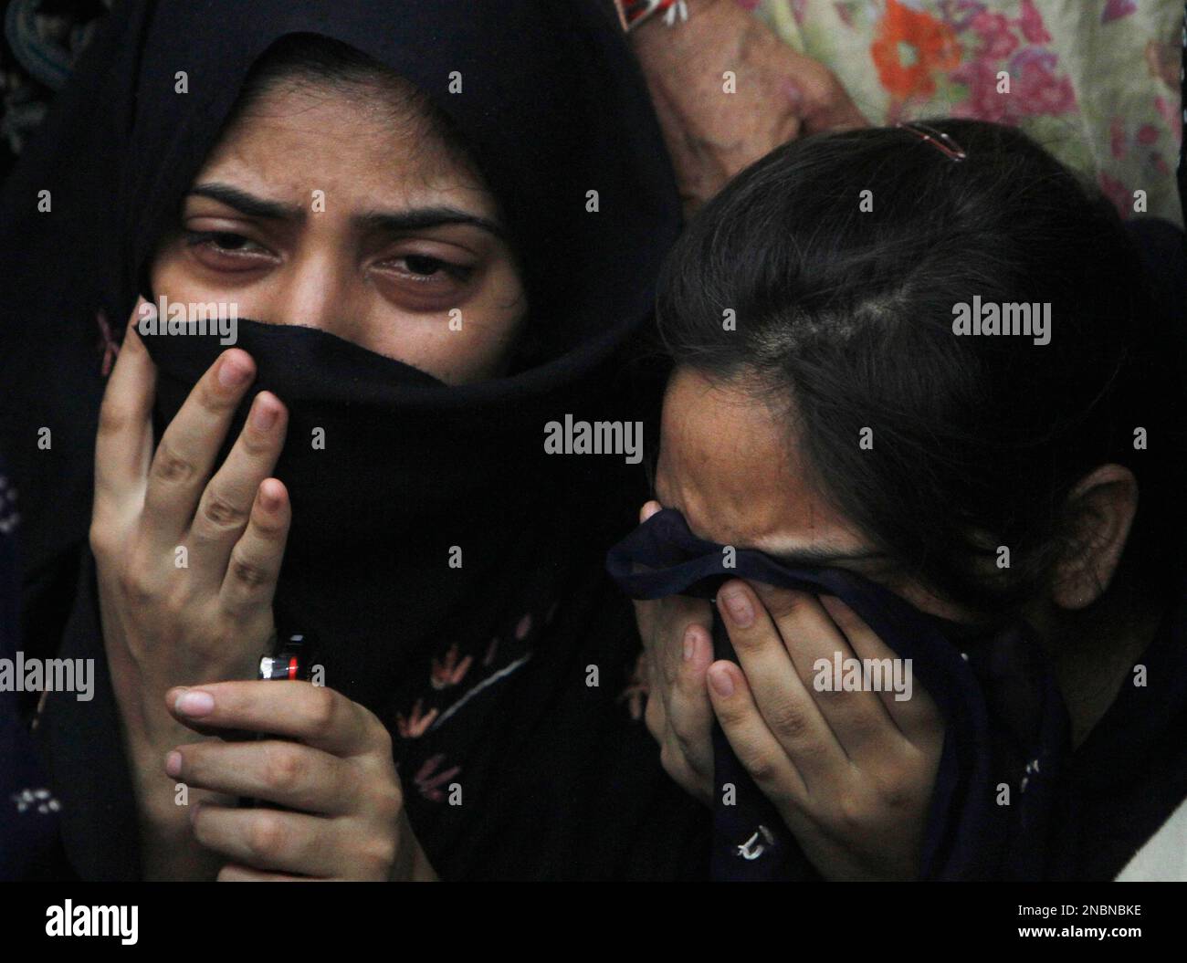 Family members of the allegedly executed boy mourn his death in Karachi ...