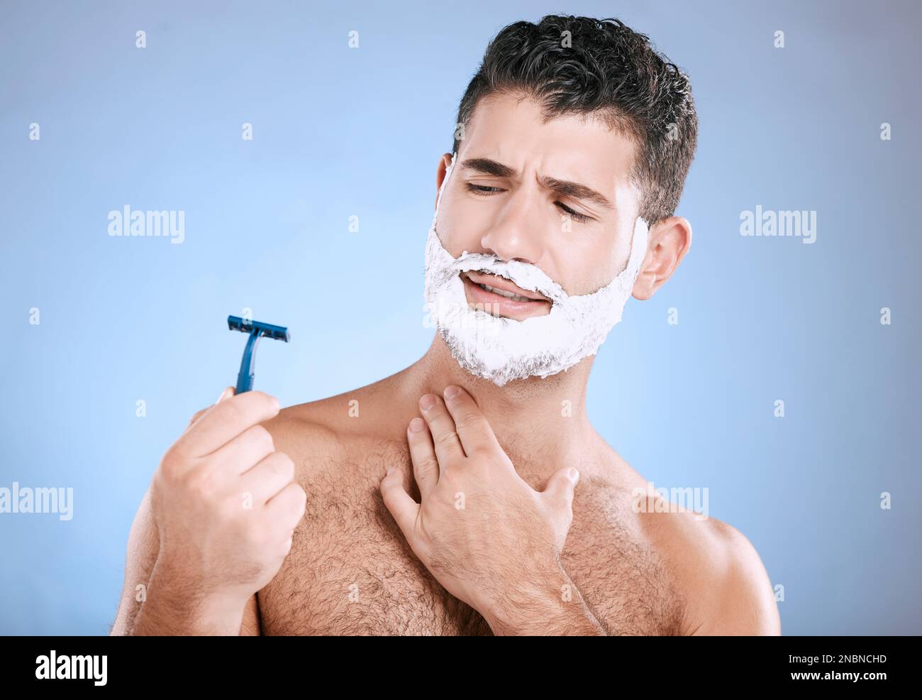 Shaving, beard and confused man with razor in hand, foam product placement in studio mock up ...