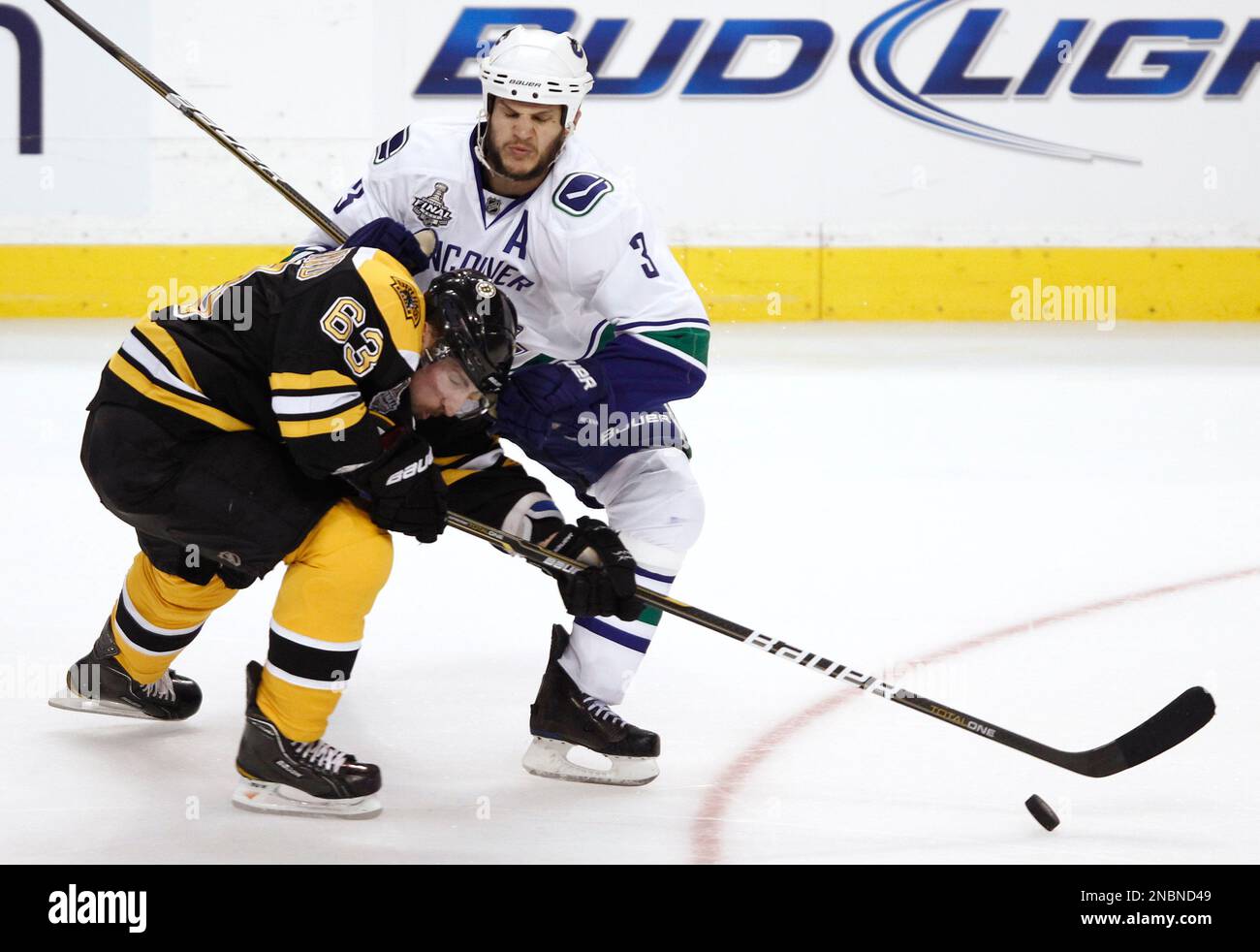 Boston Bruins left wing Brad Marchand (63) and Vancouver Canucks ...