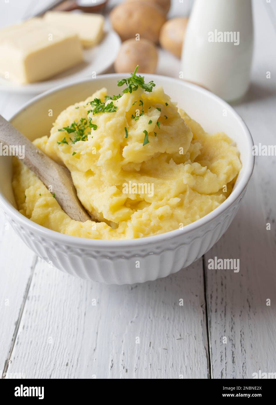 Mashed potatoes in a bowl on white background with space for text and ...