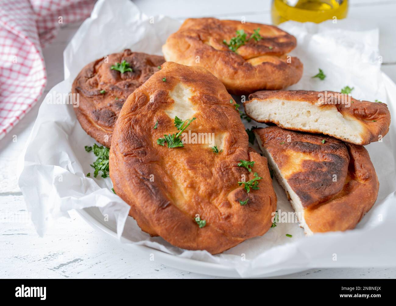 Langos, hungarian fresh pan fried bread or flatbread Stock Photo - Alamy