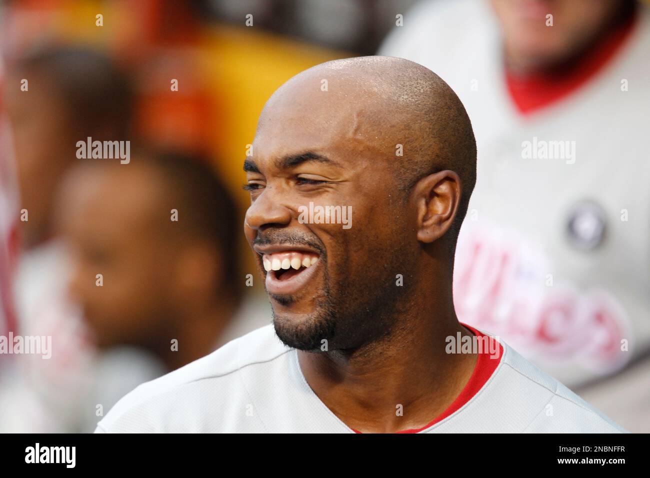Philadelphia Phillies' Jimmy Rollins walks in the dugout during a ...
