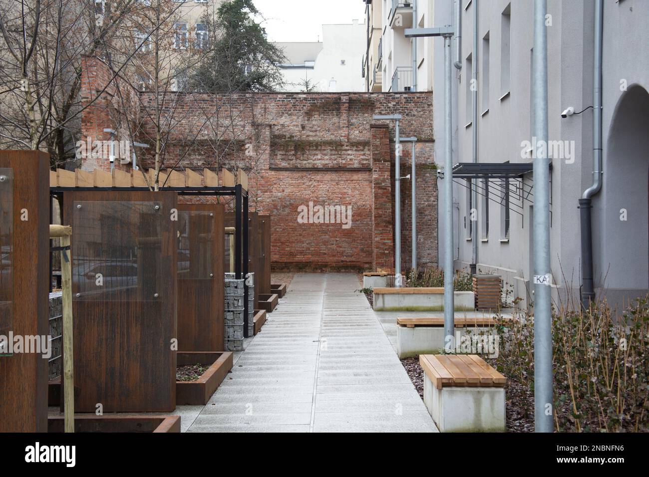 Fragment of the Warsaw Ghetto wall behind a housing estate on John Paul ...