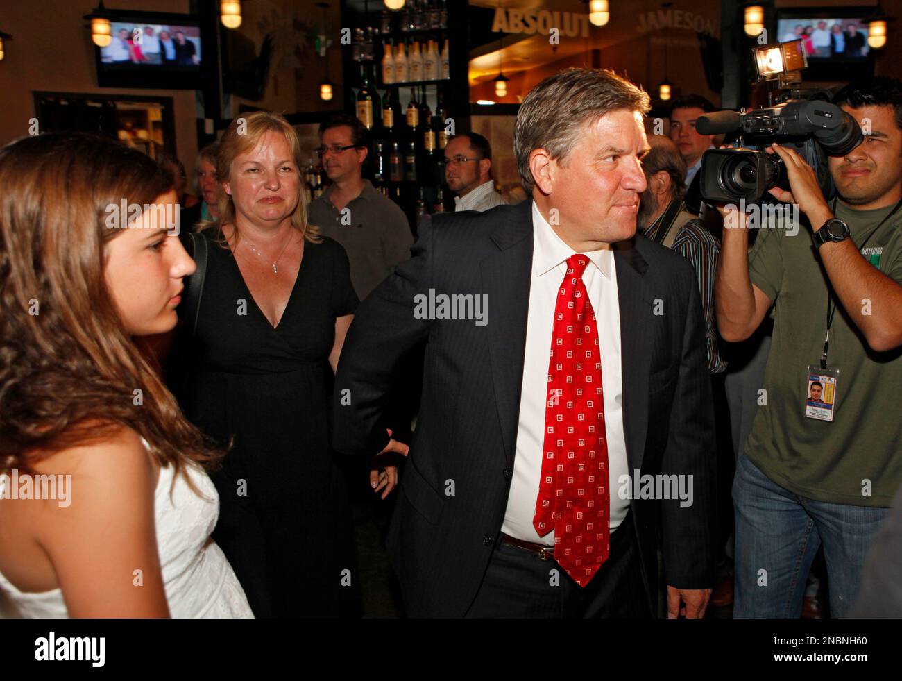 Denver mayoral candidate Chris Romer, right, arrives at an election ...