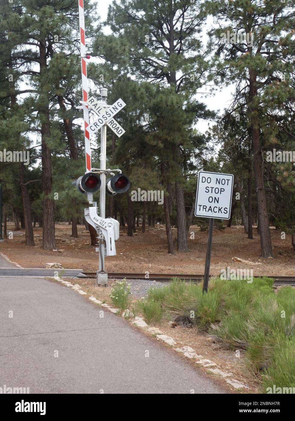 A railway crossing with an open barrier at Grand Canyon Village ...