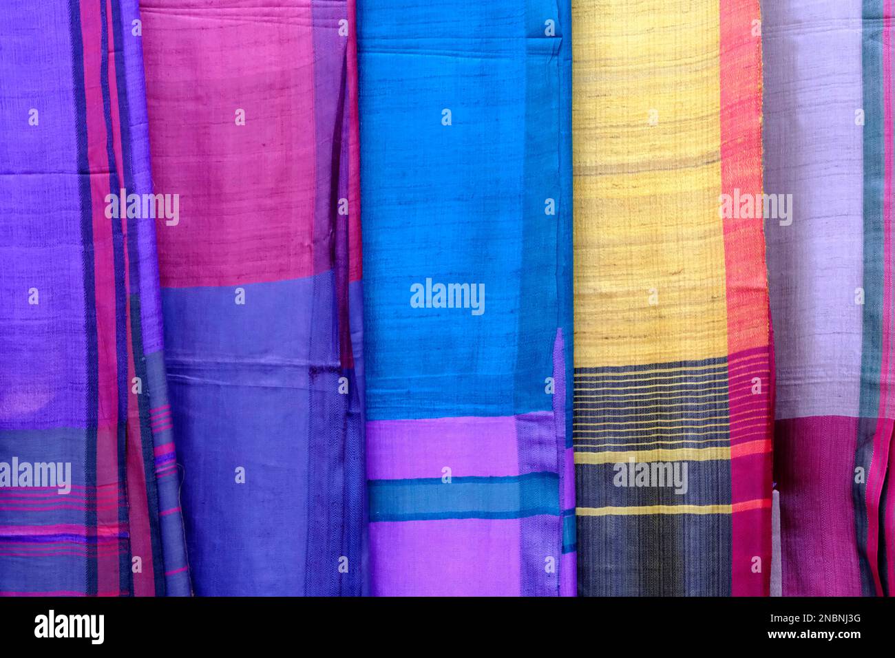 Display of vivid and colorful Indian Sari, India textile, selective ...