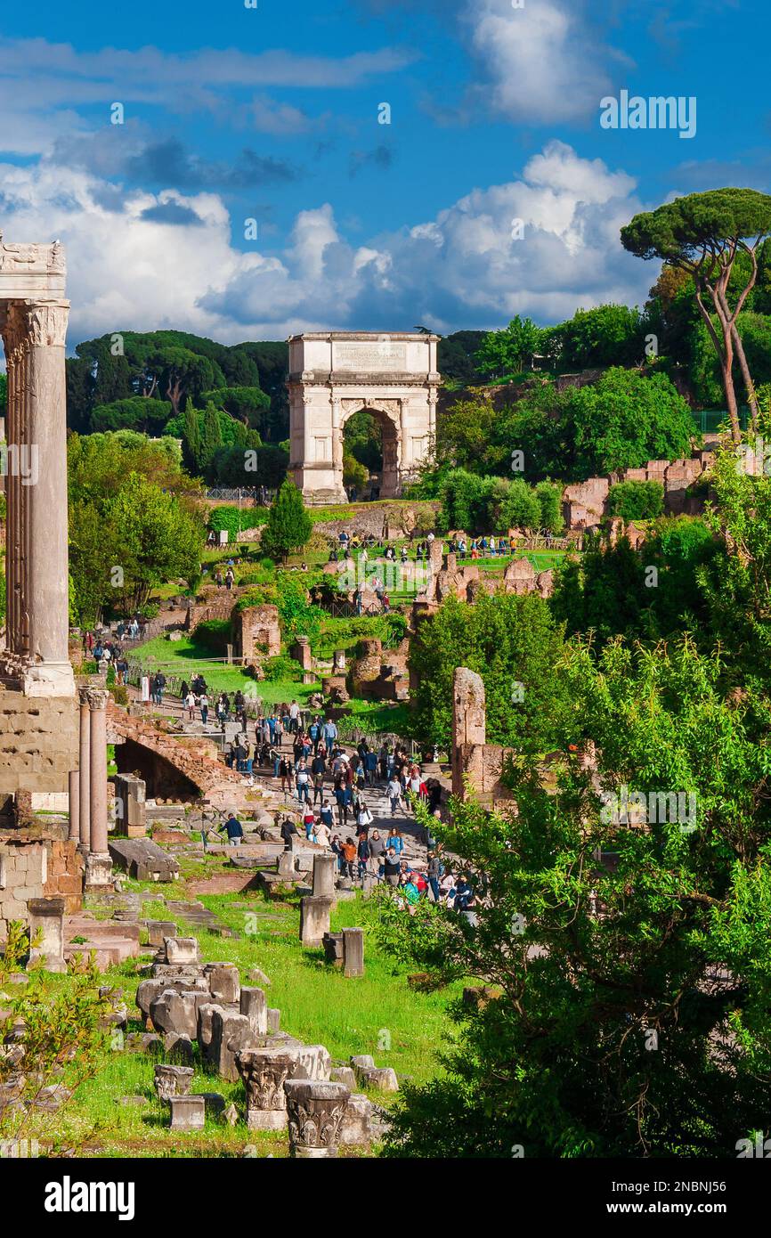 Sightseeing in Rome. Tourists visit Roman Forum ancient ruins with the ...