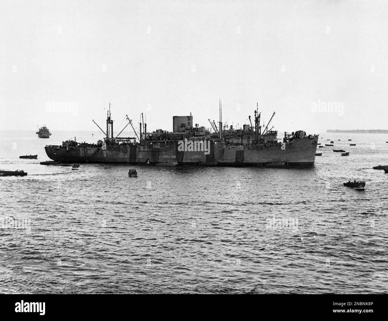 Busy landing craft swarm around transports standing off Bougainville ...
