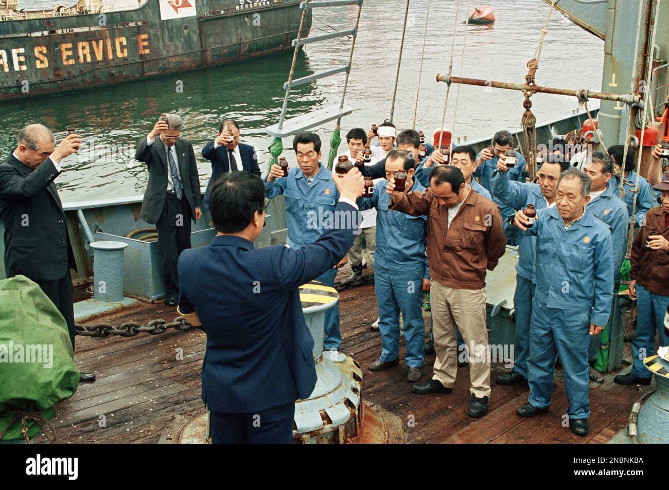 Crew members of a catcher boat, which belongs to the Dai-San Nisshin ...