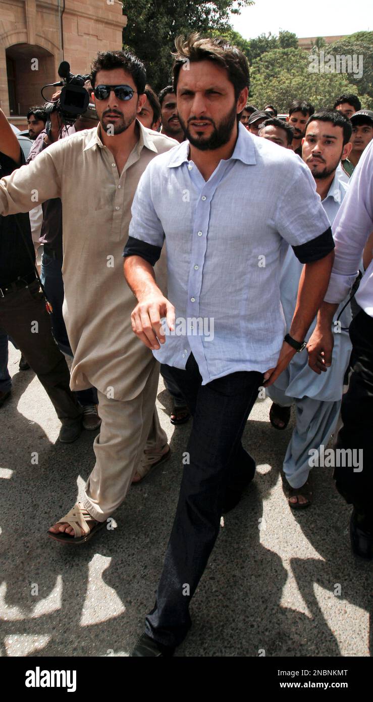 Former captain of Pakistani cricket team Shahid Afridi, center, leaves ...