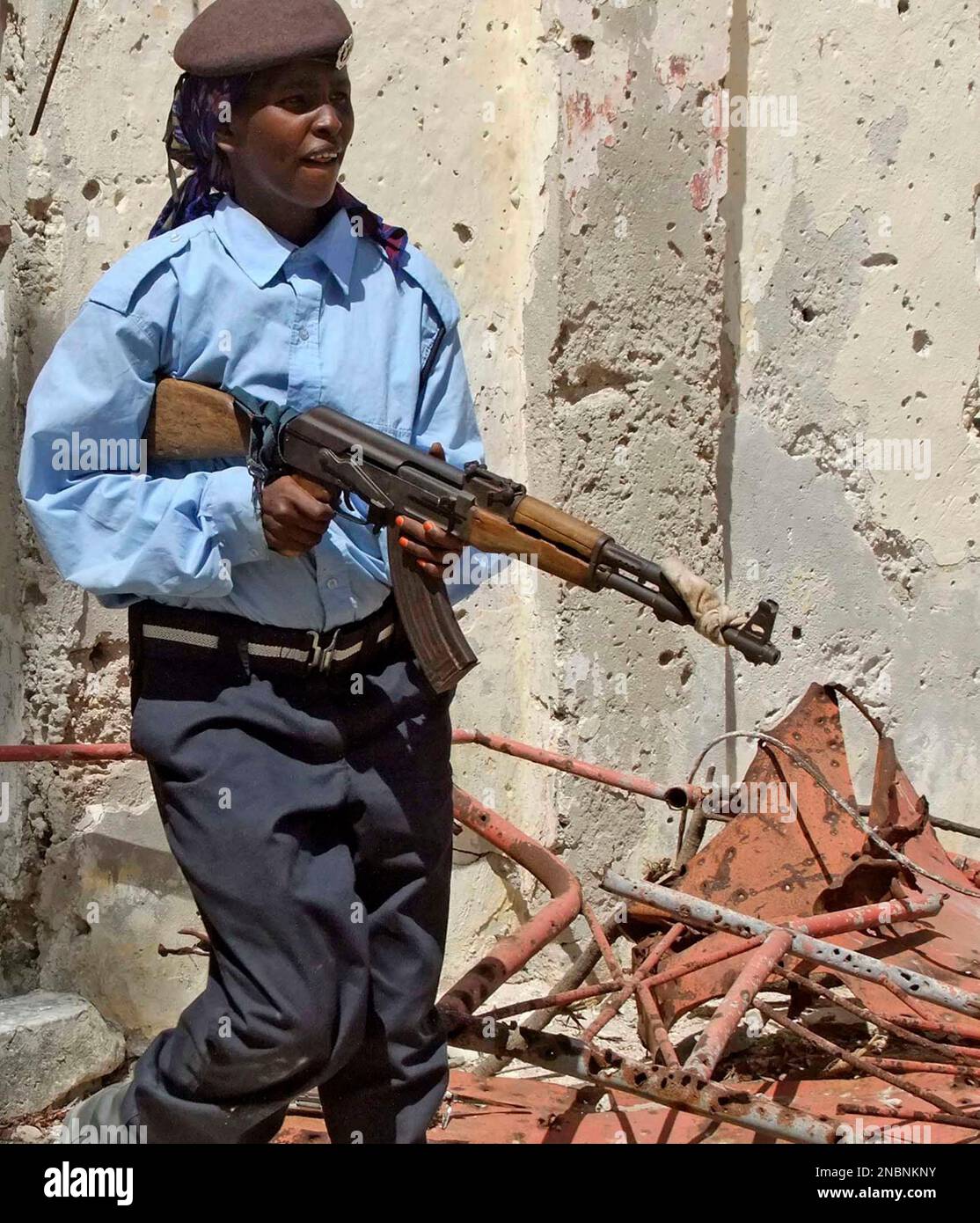 A Somali police woman take position during clashes between Somali ...