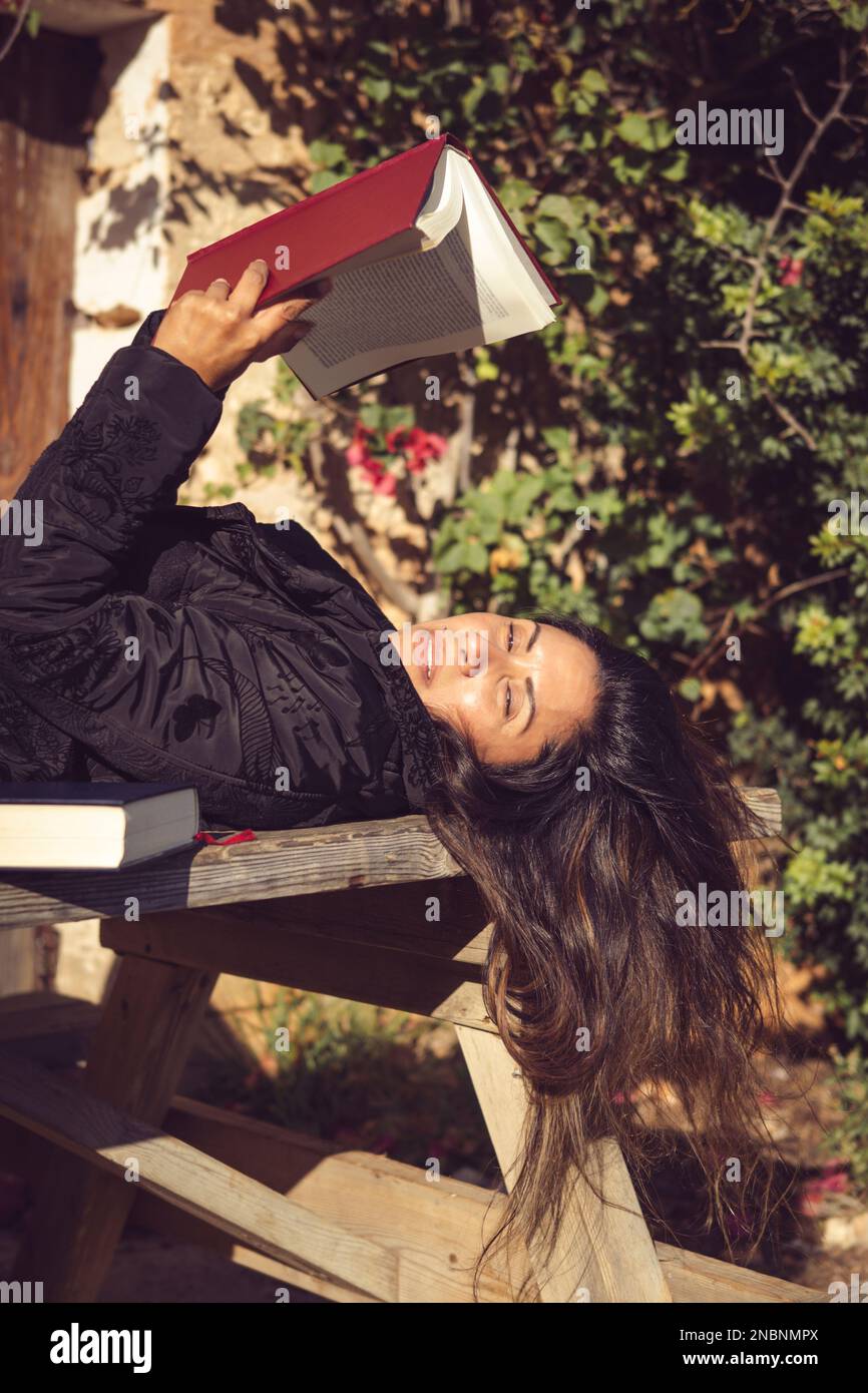 Beautiful woman reading in hi-res stock photography and images - Alamy