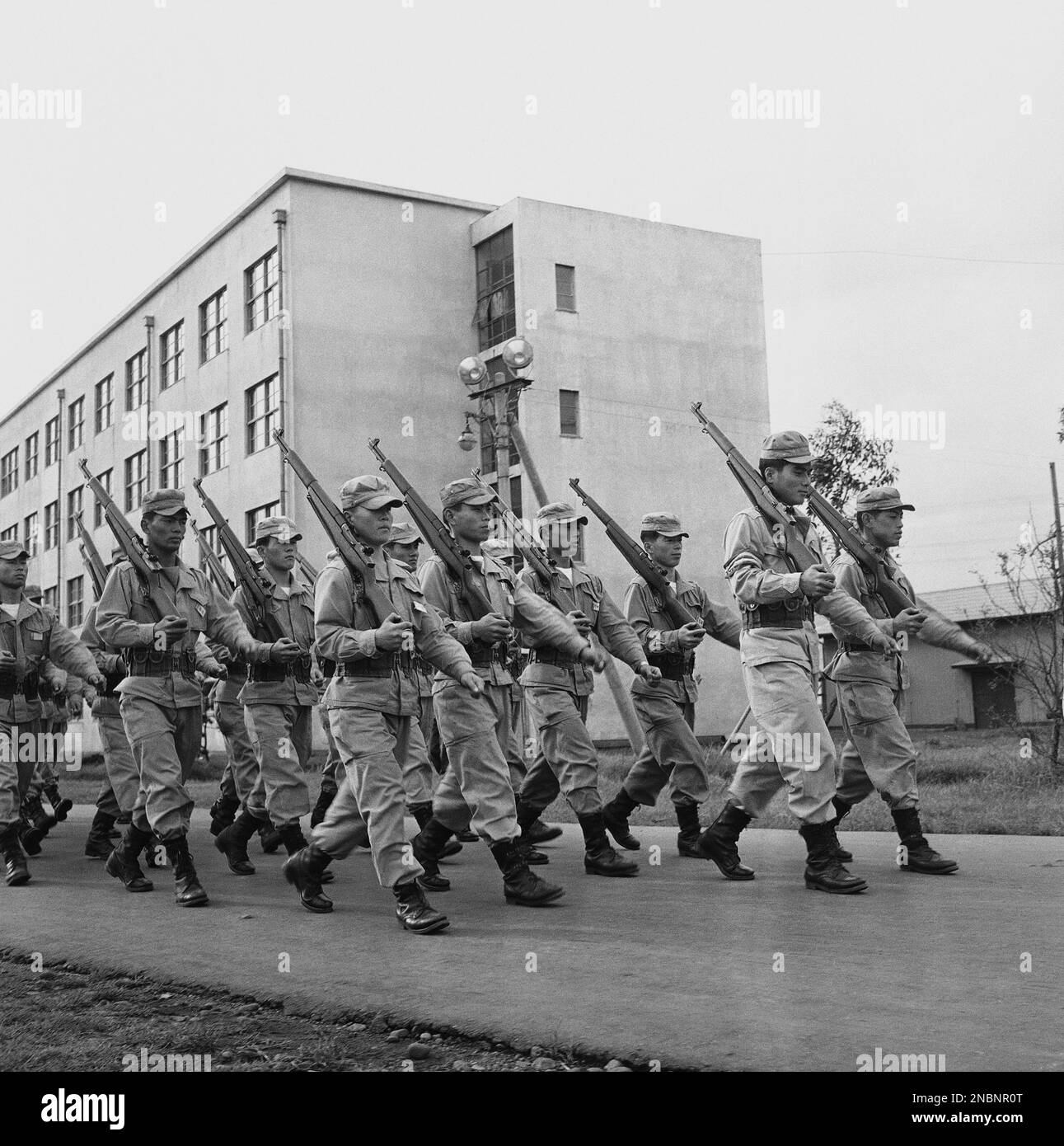 Cadets at Japan’s military academy at Kurihama, march in combat uniform ...