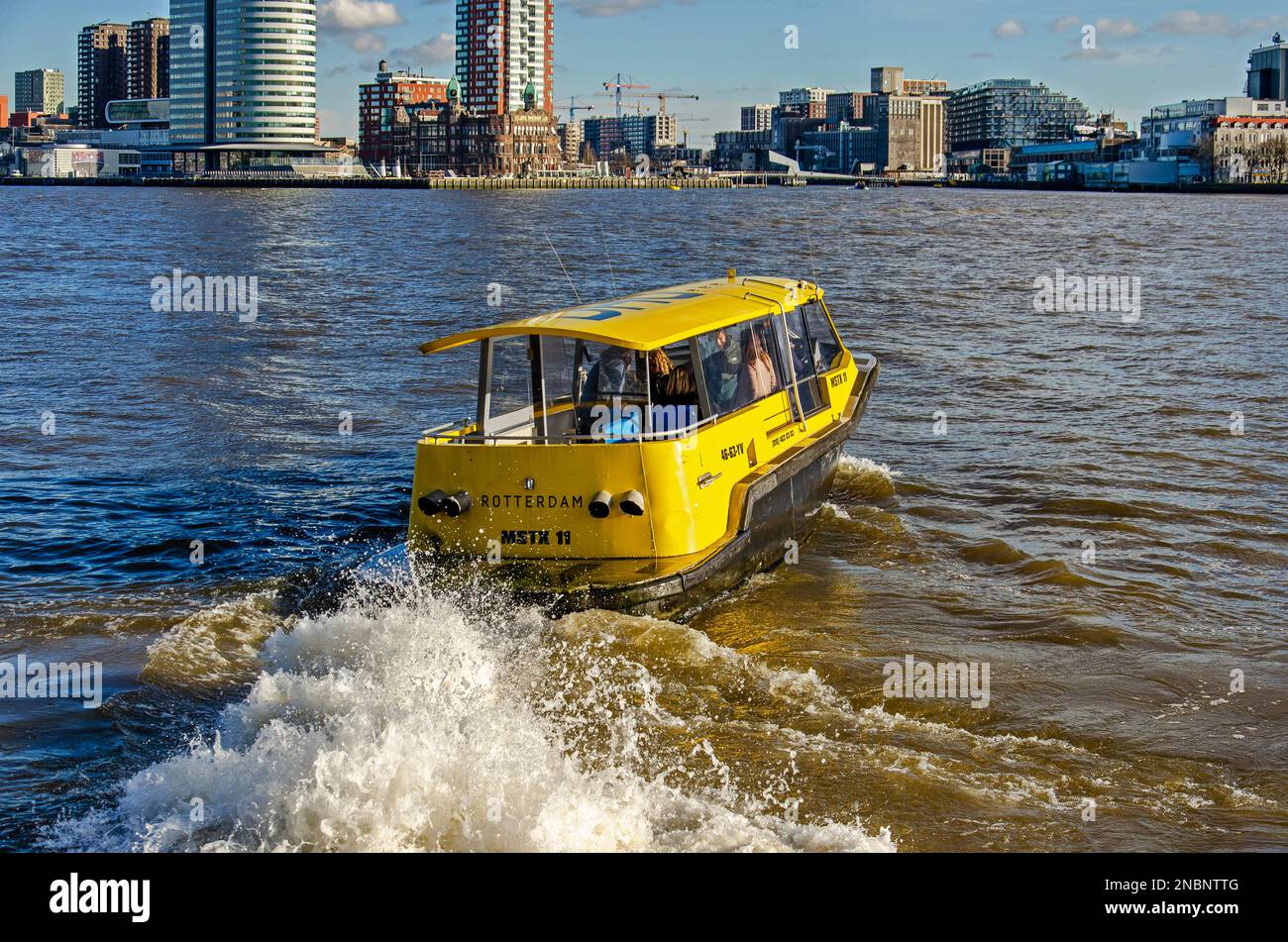 Rotterdam, The Netherlands, Januari 17, 2023: a yellow watertaxi leaves ...